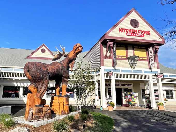 The iconic moose sculpture welcomes bargain hunters to the Kitchen Store Outlet, where culinary dreams and wallet-friendly prices peacefully coexist.