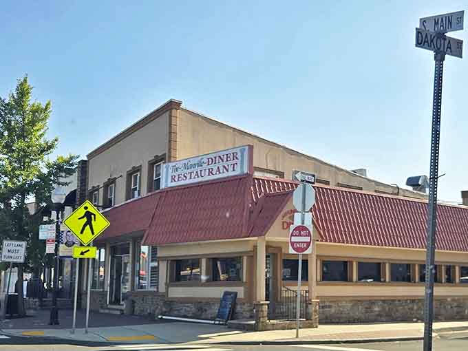 The iconic red roof of Manville Diner beckons hungry travelers like a lighthouse guiding ships to safe harbor. Classic Jersey diner architecture at its finest.