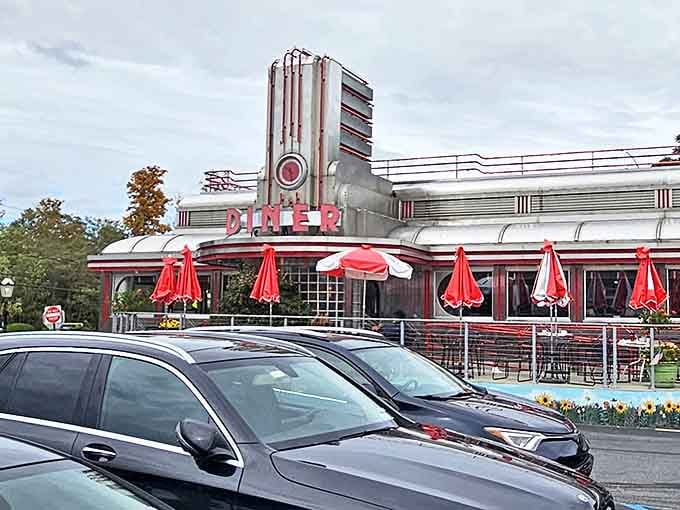 The gleaming Art Deco facade of Eveready Diner stands like a chrome-plated time machine, complete with those iconic red umbrellas beckoning hungry time travelers.