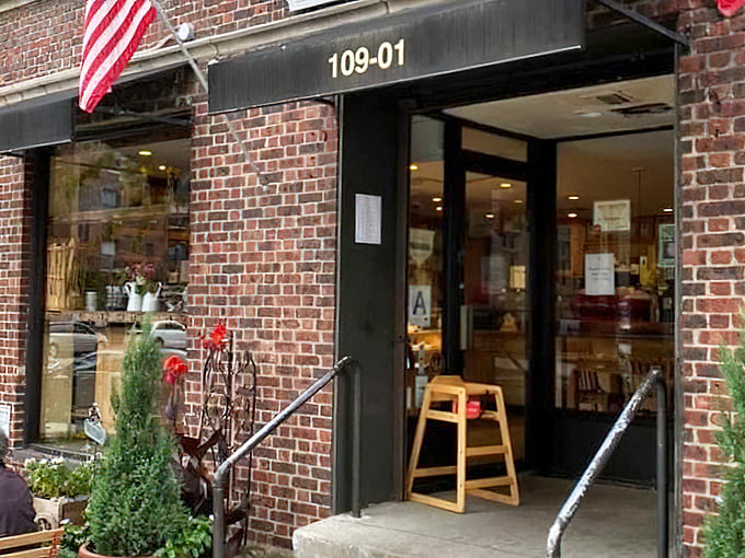 A glimpse of Parisian charm in Forest Hills &ndash; those little potted evergreens standing guard like miniature sentinels protecting the treasure trove of carbs within.