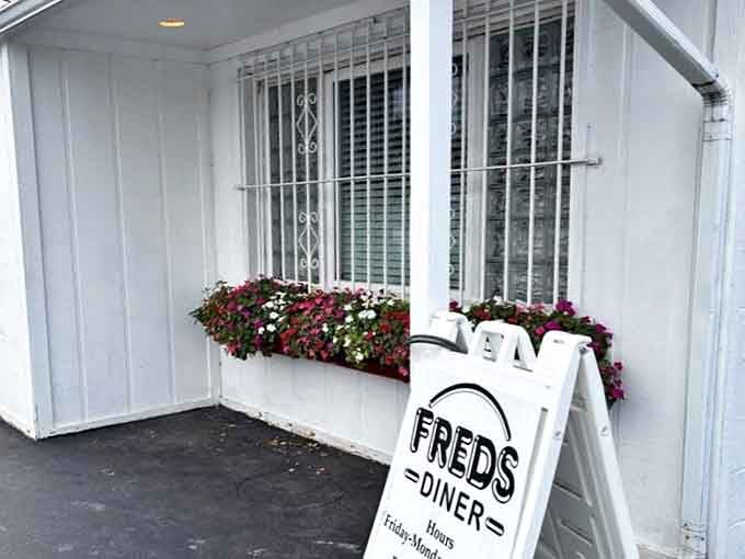 Fred's welcoming entrance, complete with cheerful flower boxes, proves that the best diners don't need fancy facades to serve up extraordinary comfort food.