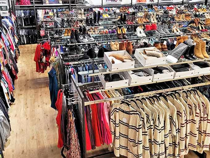 Neatly organized racks showcase an impressive selection of clothing and footwear, creating a treasure hunter's paradise at Uptown Cheapskate.