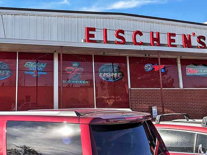 The iconic red lettering of Eischen's stands out against the white facade, like a beacon calling hungry travelers home to fried chicken paradise.