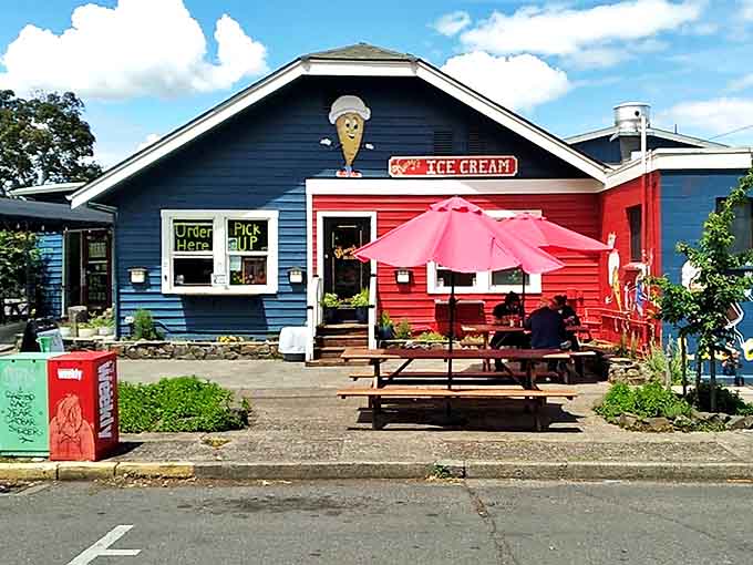 Mandy's cheerful blue exterior with red accents and outdoor seating invites hungry diners to experience Eugene's breakfast paradise.