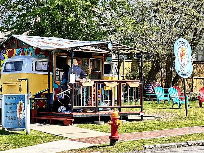 The iconic yellow VW bus that houses I Dream of Weenie stands as East Nashville's most whimsical culinary landmark. Colorful chairs invite you to stay awhile.