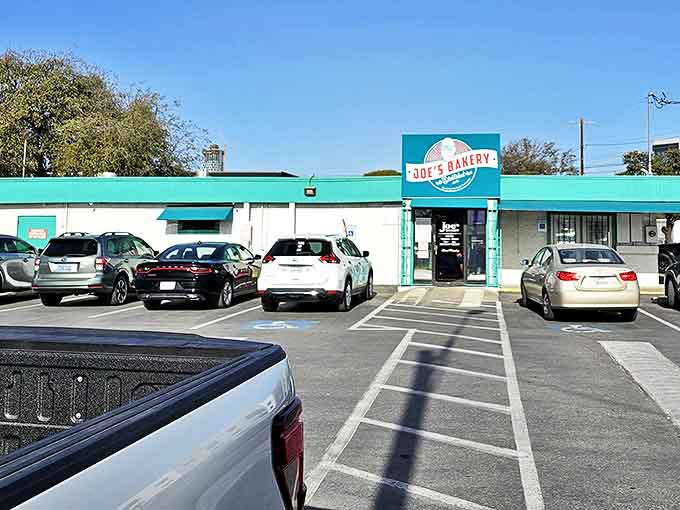 The turquoise-trimmed exterior of Joe's Bakery stands like a beacon of culinary promise on East 7th Street, beckoning hungry Austinites with its no-frills charm.