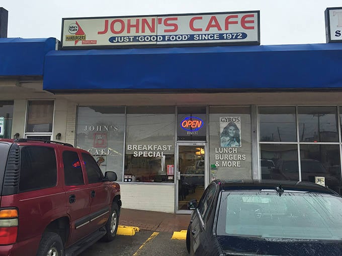 The blue awning of John's Cafe stands out like a beacon of hope for hungry travelers. "Just good food since 1973" isn't marketing&mdash;it's a promise kept.