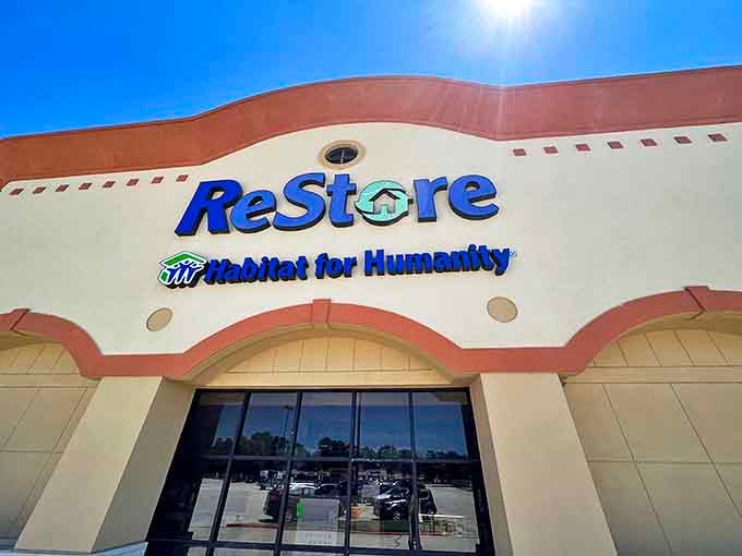 The ReStore's iconic blue signage beckons like a siren call to bargain hunters. This isn't just shopping&mdash;it's a treasure hunt with purpose, where every purchase builds someone's future home.