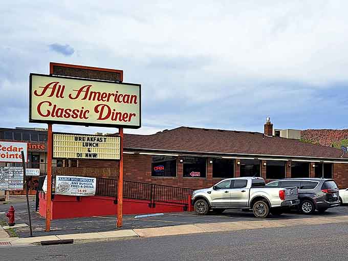 The iconic All American Classic Diner sign beckons hungry travelers like a lighthouse for the famished. Cedar City's culinary landmark stands ready to serve.