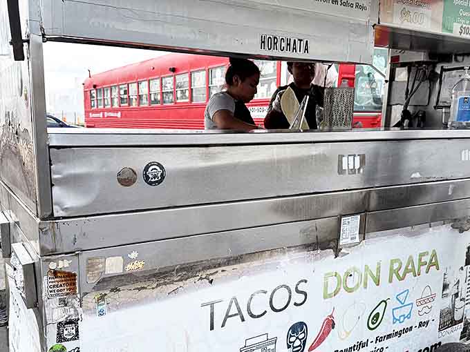 Behind this humble window, culinary magic happens. The staff works with the precision of orchestra conductors, transforming simple ingredients into symphonies of flavor.