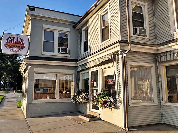 The pale green clapboard building housing Gill's Delicatessen stands as a beacon of sandwich salvation in Rutland, Vermont.