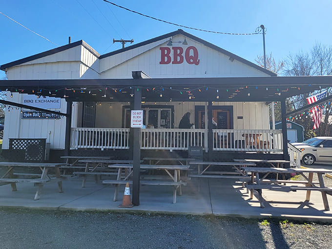 The humble white clapboard exterior belies the smoky treasures within. This is barbecue without pretense – just pure, delicious promise.