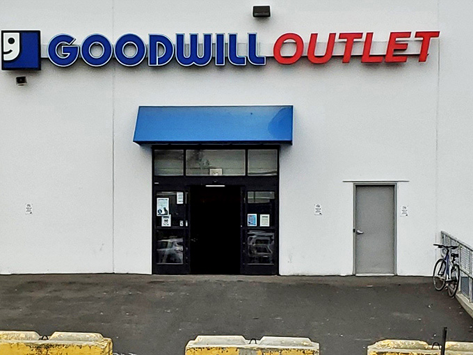 Blue and red signage beckons like a retail lighthouse, guiding bargain hunters to shores of secondhand abundance.