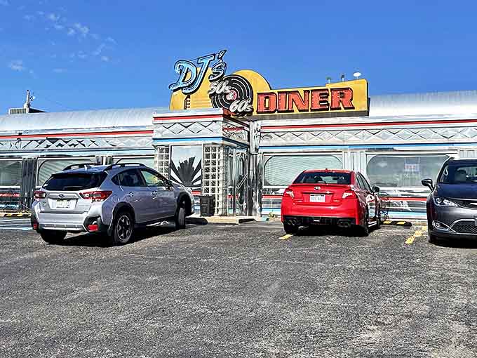 The gleaming chrome exterior of DJ's 50's & 60's Diner beckons hungry travelers with its authentic retro signage and nostalgic charm.