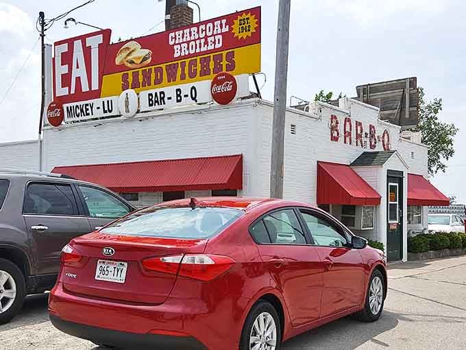 The iconic Mickey-Lu Bar-B-Q sign has been beckoning hungry travelers since the 1940s. That "EAT" command isn't a suggestion&mdash;it's the best advice you'll get all day.
