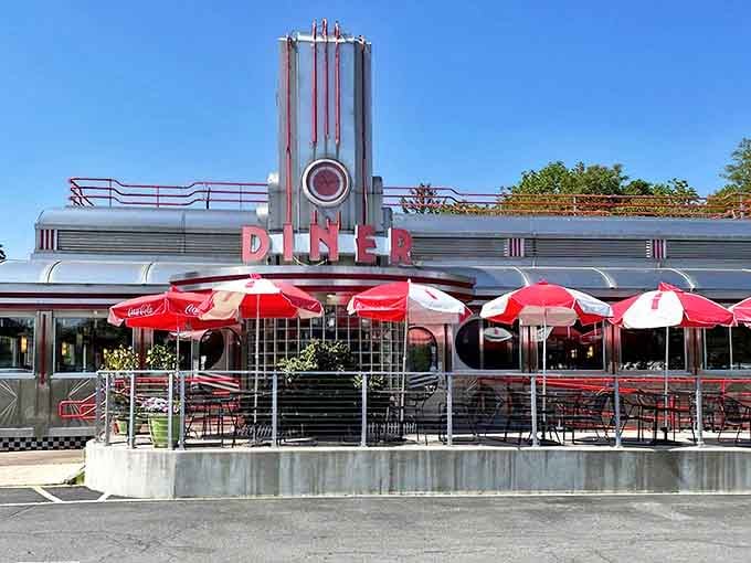 The gleaming Art Deco facade of Eveready Diner stands like a chrome-plated time machine, complete with those iconic red umbrellas beckoning hungry time travelers.