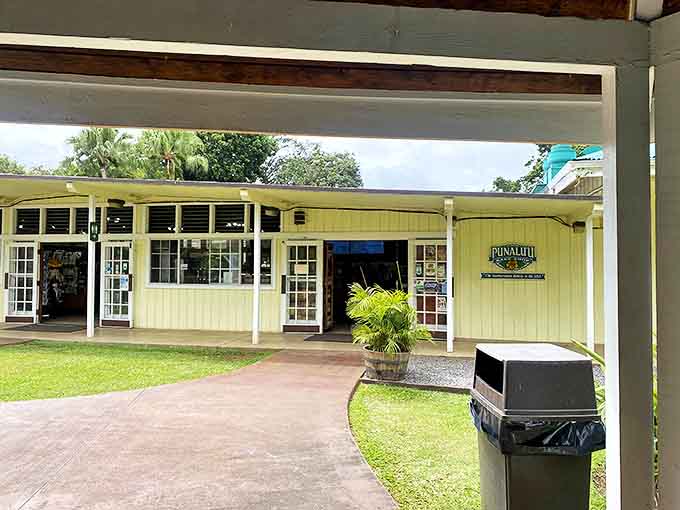 The cheerful yellow exterior of Punalu'u Bake Shop beckons like a tropical mirage, promising sweet relief from your island adventures.