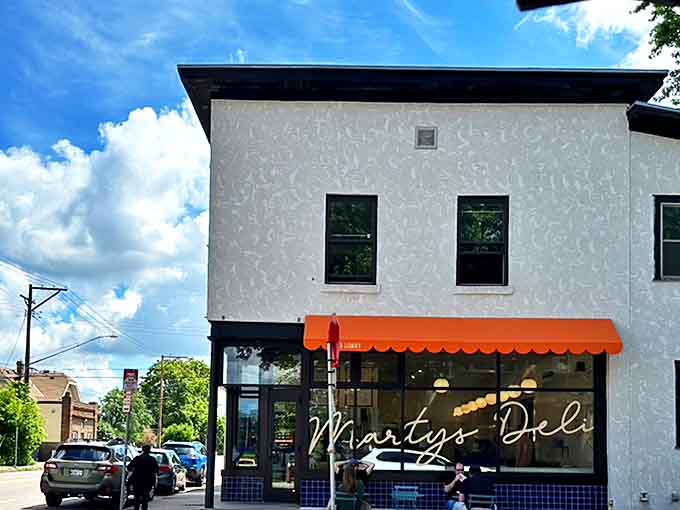 That orange awning isn't just a splash of color&mdash;it's a beacon of sandwich salvation on a Minneapolis corner. Simplicity never looked so inviting.