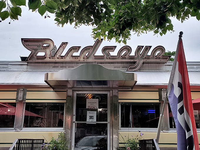 That iconic streamlined exterior shines in Vermont sunlight, promising comfort food treasures inside. The outdoor tables whisper of summer conversations over coffee and pie.