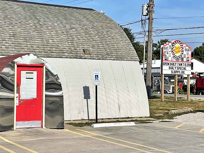 The iconic Quonset hut silhouette of Charlie Parker's stands like a time capsule of Americana, complete with that unmistakable red door beckoning hungry travelers.