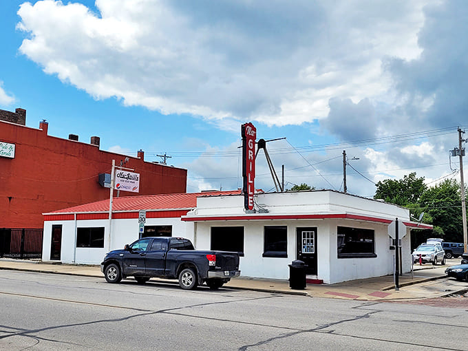 The iconic Nu Grille sign stands proud against the Kansas sky, a beacon of comfort food that's been calling hungry travelers home for generations.