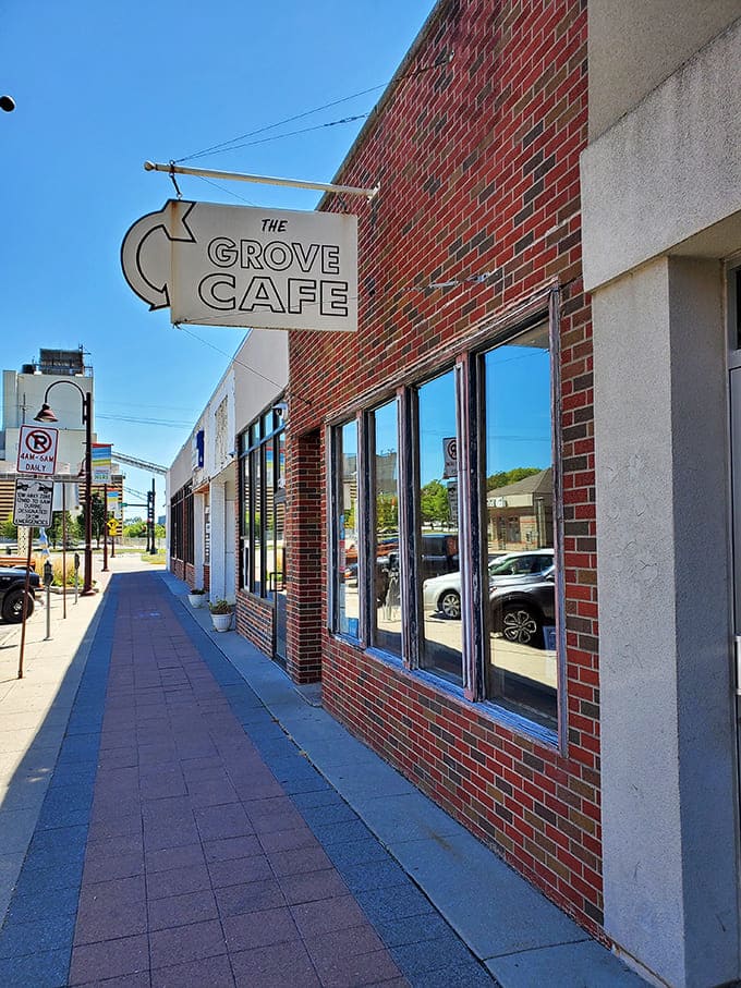 The unassuming brick exterior of The Grove Cafe on Main Street in Ames&mdash;where pancake perfection hides behind a modest facade.