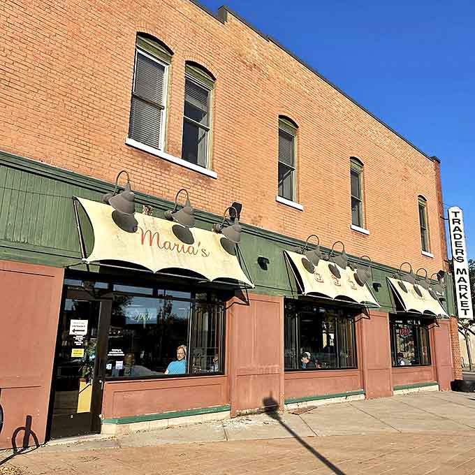 Maria's Cafe's modest awning and brick facade hide the culinary treasures within – proof that appearances can be deliciously deceiving.