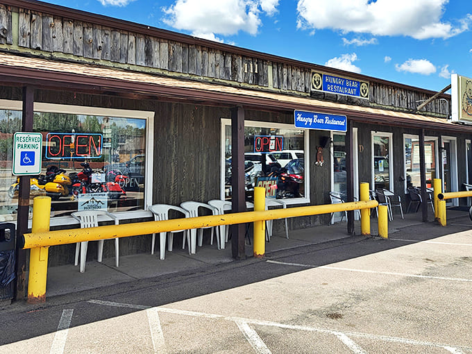 The rustic wooden exterior of Hungry Bear beckons with its bright yellow barriers and simple charm&mdash;Colorado mountain dining at its unpretentious best.