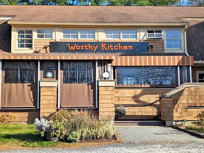 The cedar-shingled charm of Worthy Kitchen beckons like an old friend, promising comfort food with a gourmet twist in Vermont's picturesque landscape.