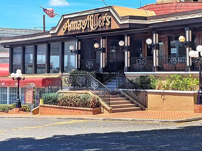 The iconic wooden fa&ccedil;ade of Anna Miller's welcomes diners with its vintage charm and American flag, a slice of nostalgic Americana in Aiea.