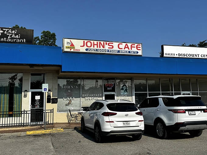The blue awning of John's Cafe stands out like a beacon of hope for hungry travelers. "Just good food since 1973" isn't marketing&mdash;it's a promise kept.