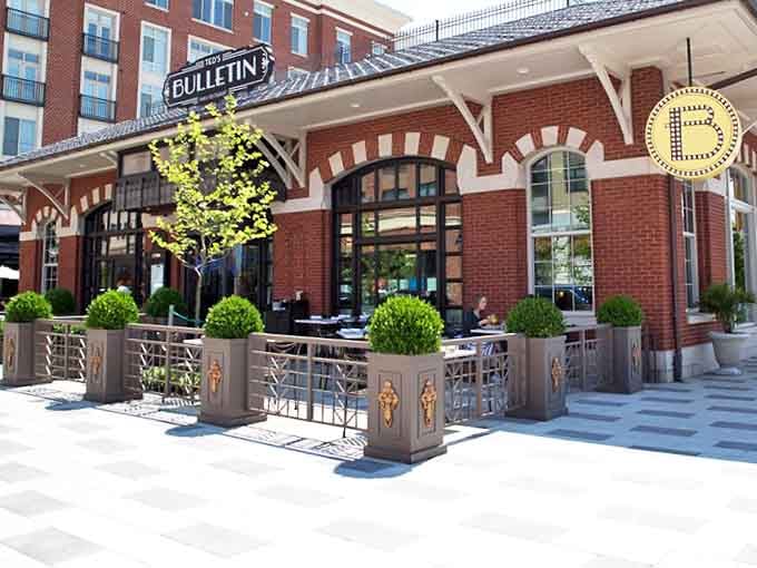 The welcoming entrance of Ted's Bulletin, flanked by manicured greenery, stands ready to rescue you from mundane meals with its nostalgic comfort food creations.