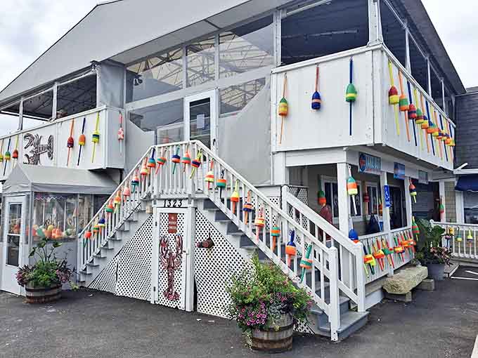The iconic white exterior of Petey's, adorned with colorful fishing buoys and that unmistakable lobster sign, beckons seafood lovers like a maritime siren song.