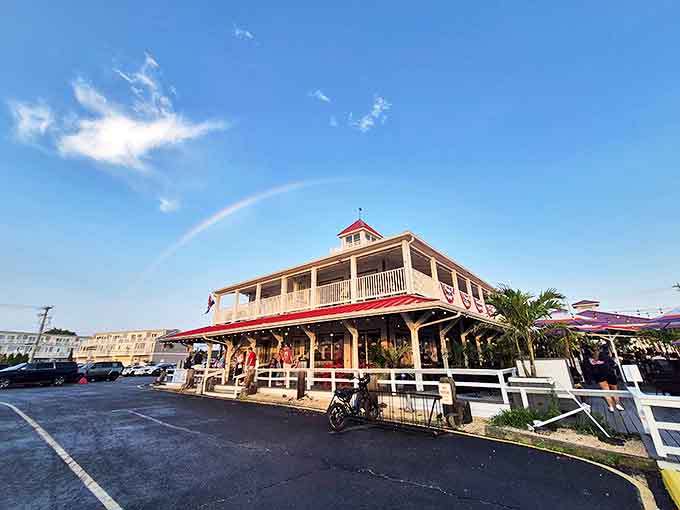 The iconic red-roofed Wheelhouse stands like a maritime lighthouse for hungry souls, promising seafood treasures within its distinctive coastal architecture.