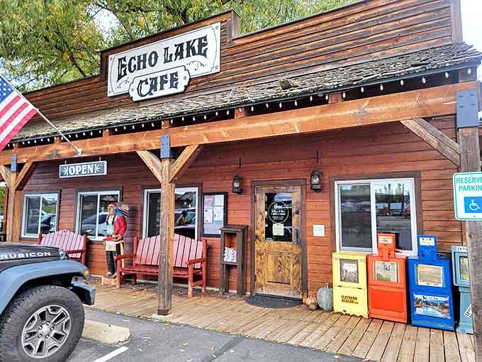 Red Adirondack chairs invite weary travelers to pause before entering this timber treasure chest of breakfast delights.