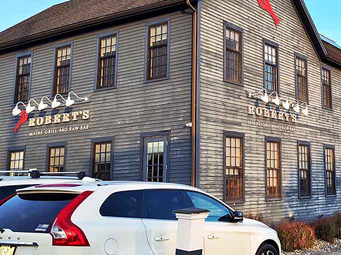 The iconic blue exterior of Robert's Maine Grill stands like a beacon for seafood lovers, promising maritime delights within those New England clapboard walls.