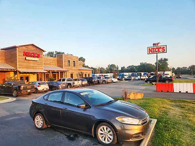 The evening sun casts a warm glow on Nick's wooden fa&ccedil;ade, while the packed parking lot tells the real story: word about those legendary hush puppies has definitely gotten out.