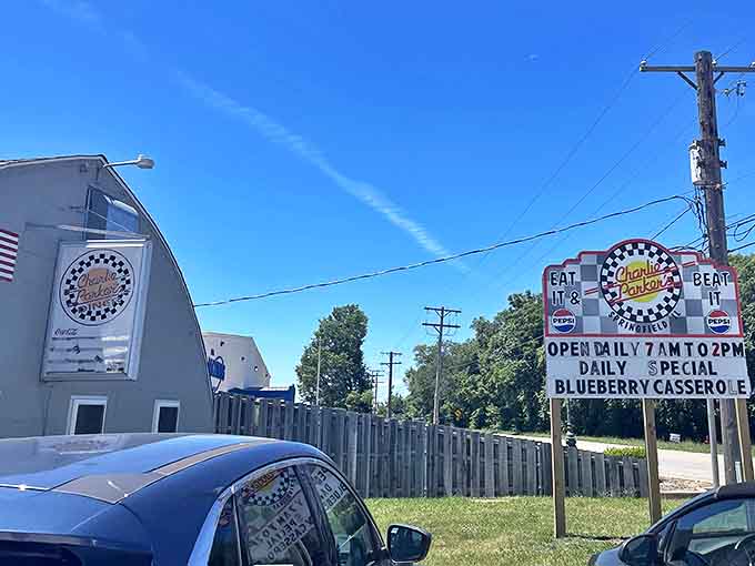 Blue skies frame this roadside beacon of breakfast brilliance, where the sign's promise of "Blueberry Casserole" might just be worth changing your entire day's plans for.