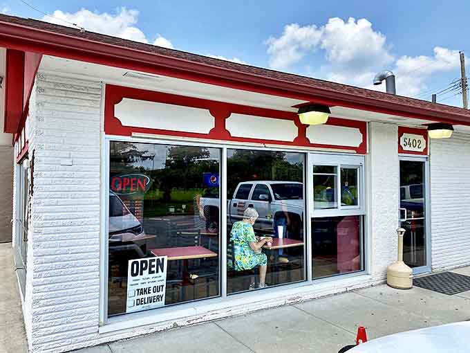 That iconic red roof signals barbecue salvation ahead. Hartland's modest exterior hides smoky treasures that have kept Omaha coming back for generations.