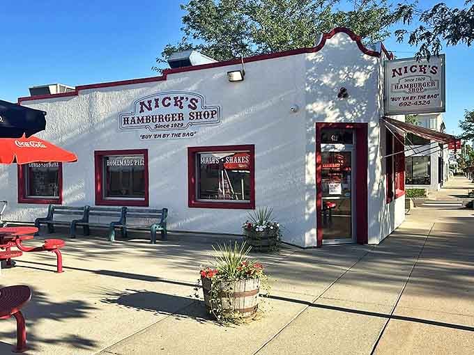 The iconic white building with red trim stands like a time capsule on Brookings' Main Avenue, beckoning burger lovers since 1929.