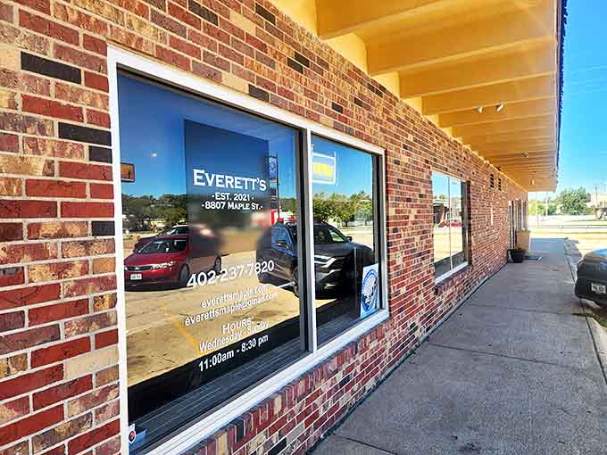 The window tells the story: established, located, and ready to serve. Like finding the entrance to Narnia, but instead of a magical wardrobe, it's smoky barbecue paradise.