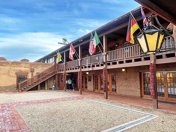 International flags flutter above The Fort's courtyard, a nod to the universal language of exceptional food that transcends borders and brings people together.