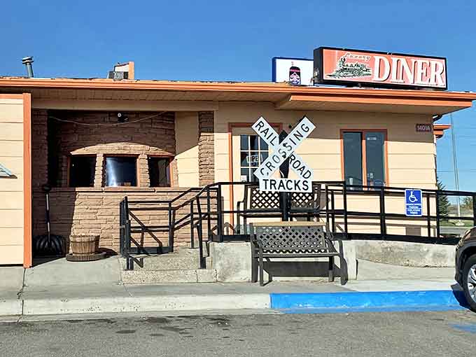 The railroad crossing sign isn't just decoration&mdash;it's a promise that this converted trolley car diner will transport you to flavor town without leaving Cheyenne.