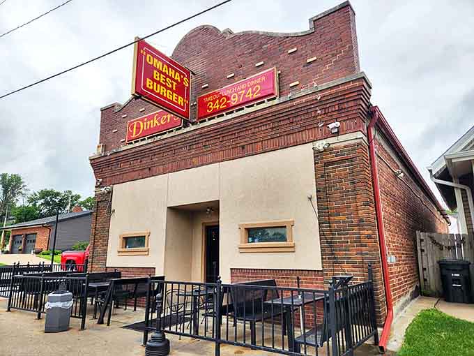 The unassuming brick exterior of Dinker's proudly proclaims its reputation with the bold "Omaha's Best Burger" sign.