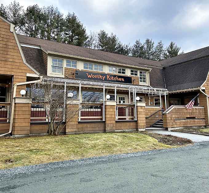 The cedar-shingled charm of Worthy Kitchen beckons like an old friend, promising comfort food with a gourmet twist in Vermont's picturesque landscape.