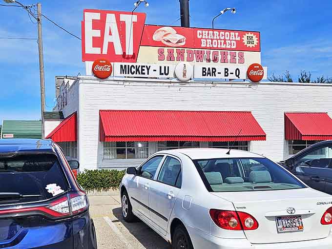 The iconic Mickey-Lu Bar-B-Q sign has been beckoning hungry travelers since the 1940s. That "EAT" command isn't a suggestion&mdash;it's the best advice you'll get all day.