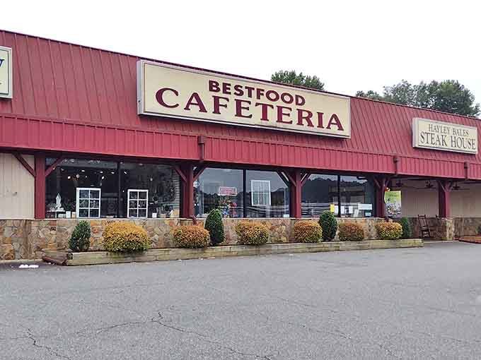 The unassuming red exterior of Bestfood Cafeteria proves once again that culinary treasures often hide behind the most modest facades. Southern comfort awaits inside!