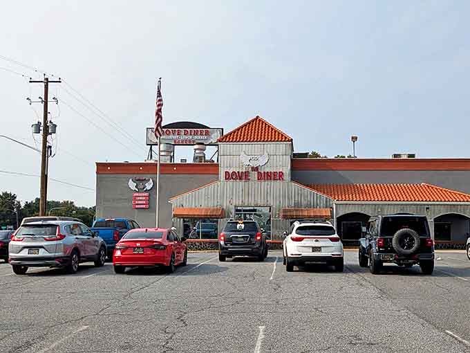 The Dove Diner's distinctive exterior beckons hungry travelers like a lighthouse for the famished. That orange-tiled roof isn't just eye-catching&mdash;it's a promise of comfort food paradise within.