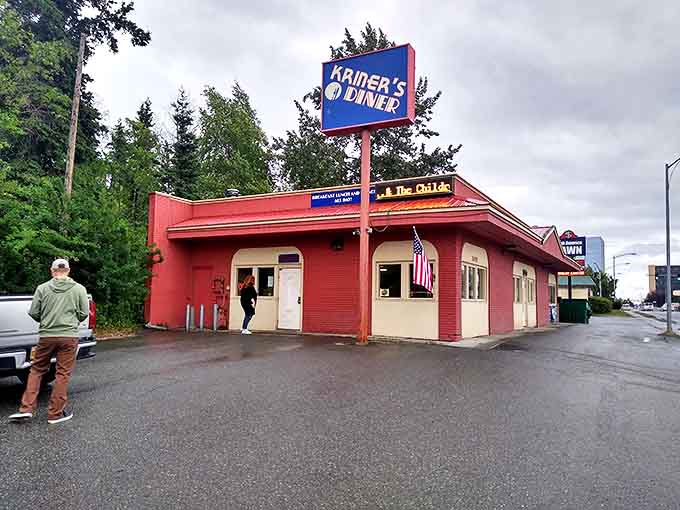 The bright blue sign of Kriner's Diner stands like a beacon of breakfast hope against Anchorage's sky, promising salvation for the hungry and caffeine-deprived.