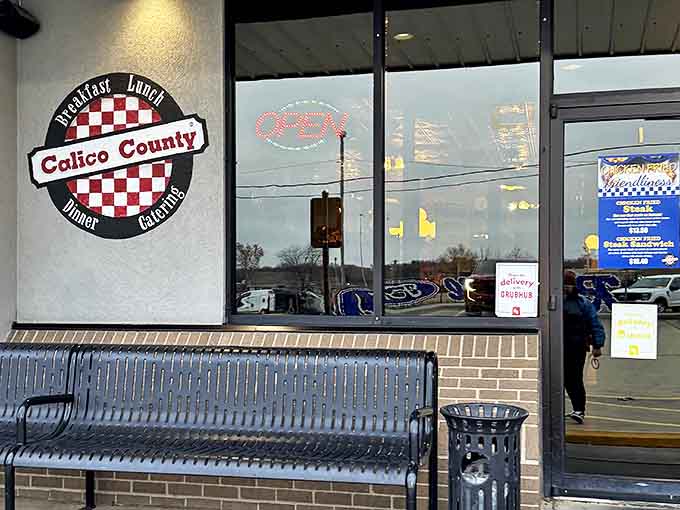 The iconic red-and-white checkered logo welcomes hungry visitors like a friendly wink from your favorite aunt who always has something delicious in the oven.